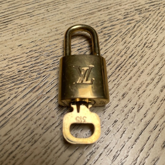 Louis Vuitton | Bags | Louis Vuitton Shiny Gold Lock And Key | Poshmark